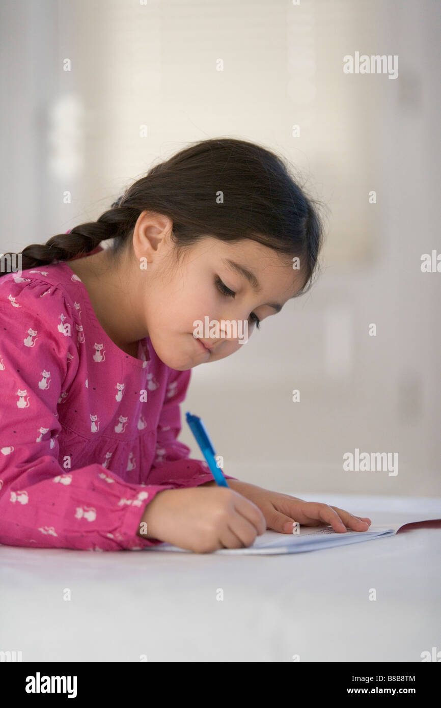 Little girl is writing letters Stock Photo - Alamy