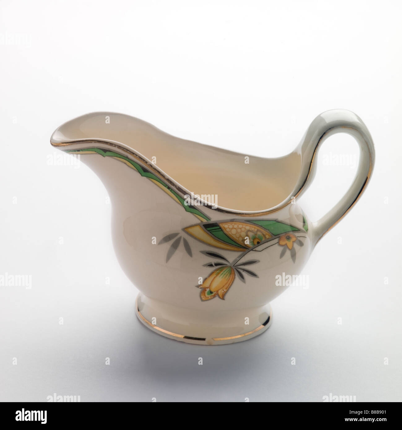 art deco pattern gravy jug on white background Stock Photo - Alamy