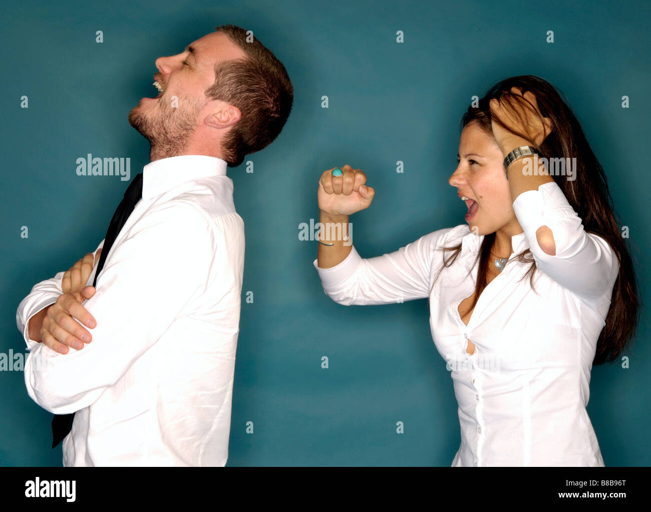 an angry stubborn businessman with back turned against female business ...