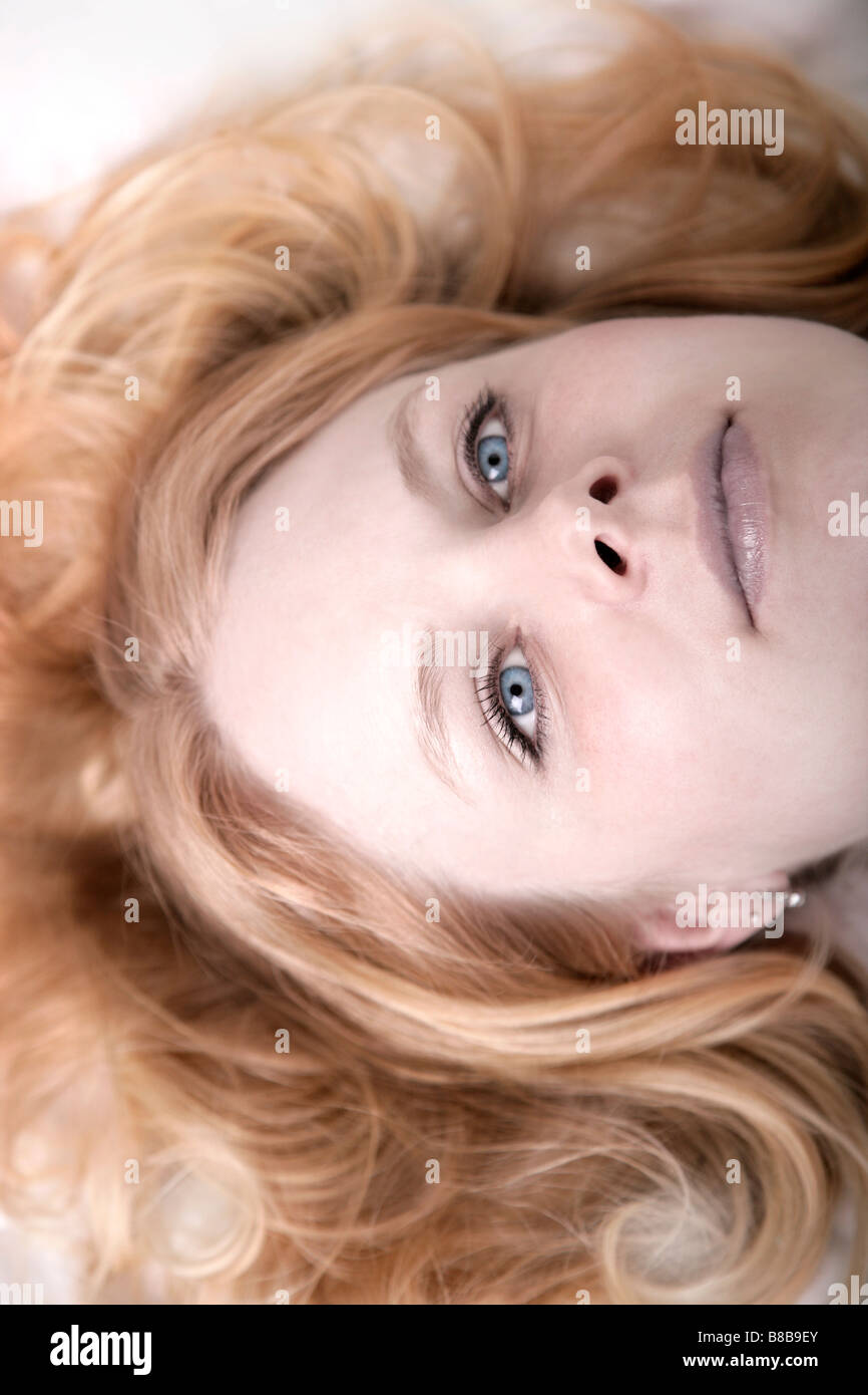 Woman laying down Stock Photo - Alamy
