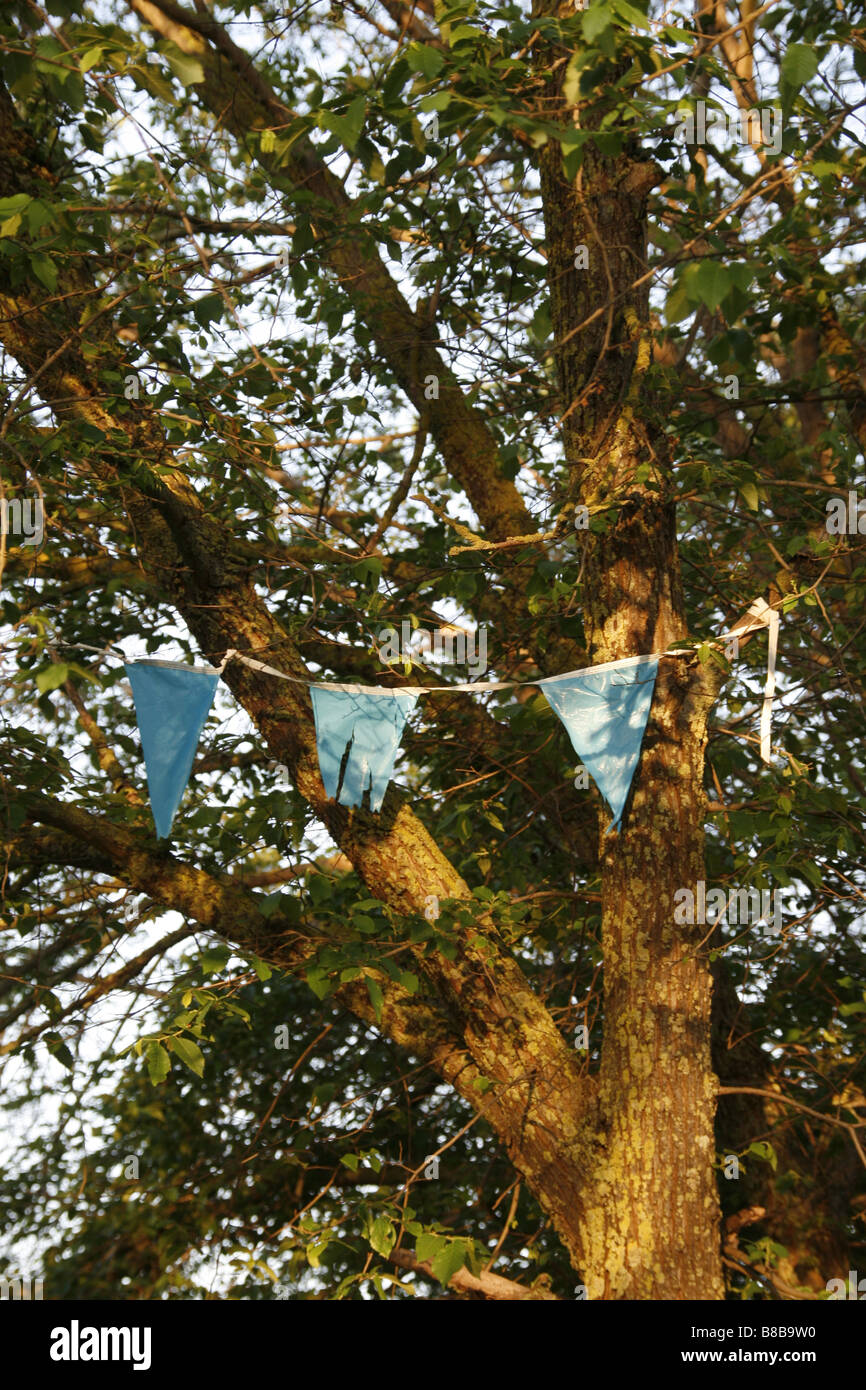 many colourful carnival flags decorations in street party outdoors in ...