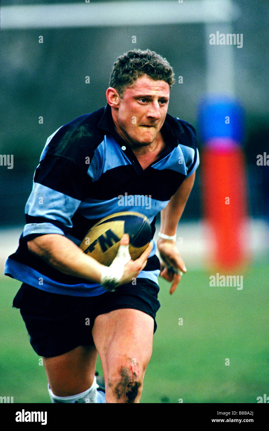 Rugby player in action Stock Photo - Alamy