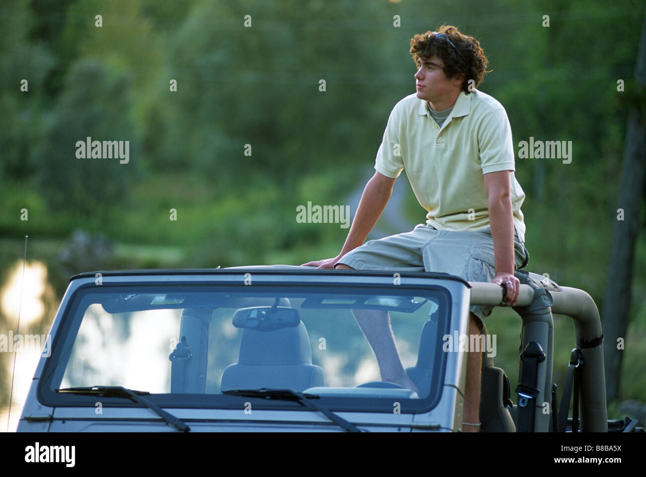 Teenage Boy Sitting Jeep Stock Photo - Alamy