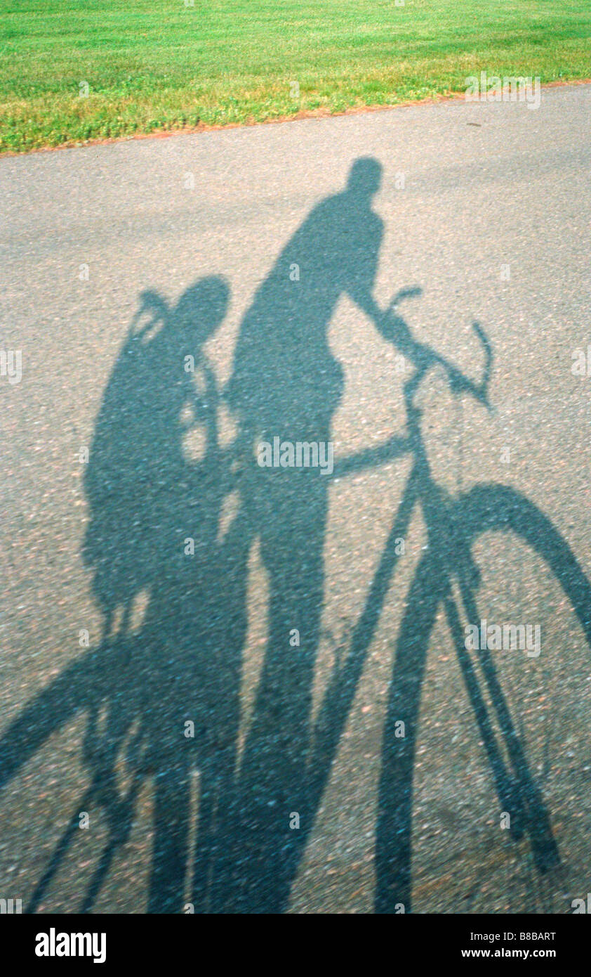 Shadow Bikers Pavement Stock Photo - Alamy