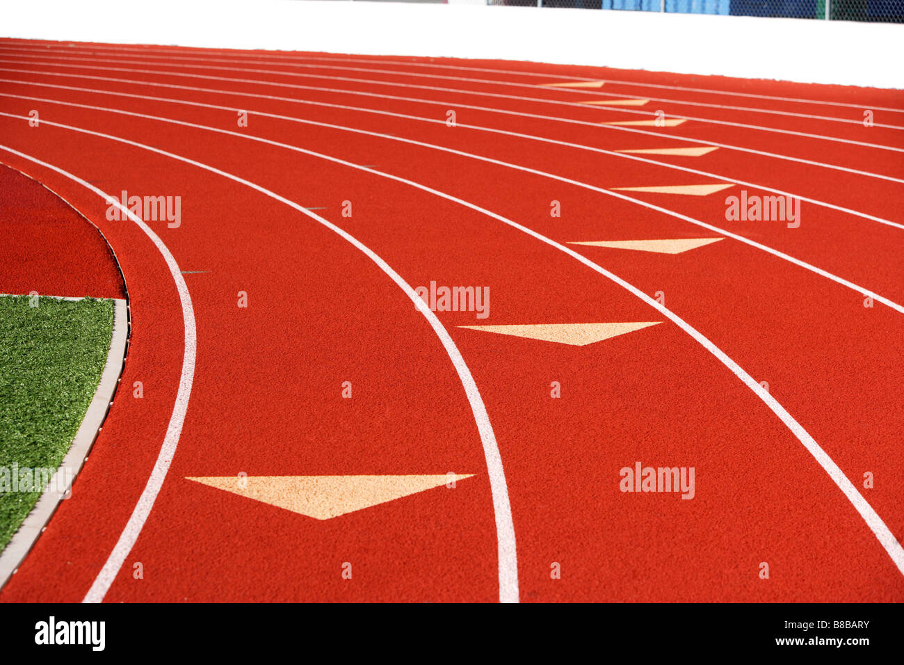A blue track at a High School Stock Photo - Alamy