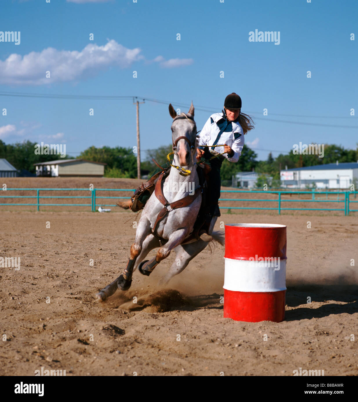 Girl Horse rounding Barrel, Brandon, Manitoba Stock Photo - Alamy