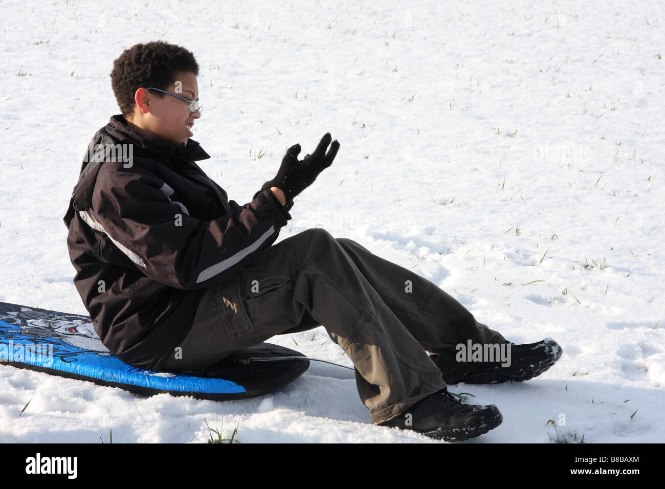 snowboard boy black ethnic mixed race happy smiling fun playing snow ...