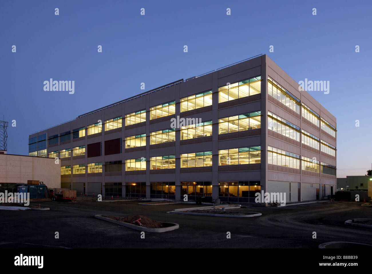 An office building with a empty parking lot Stock Photo - Alamy