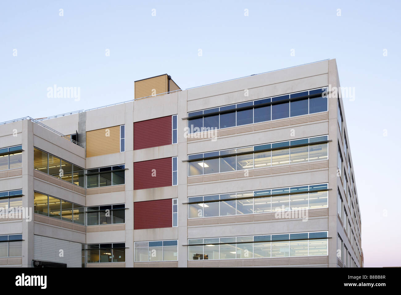 An office building with a empty parking lot Stock Photo - Alamy