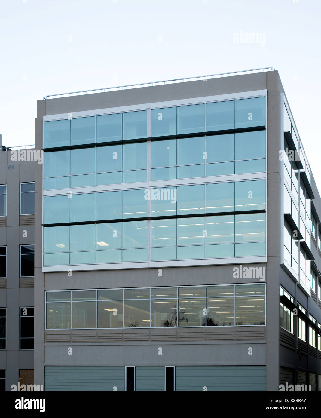 An office building with a empty parking lot Stock Photo - Alamy