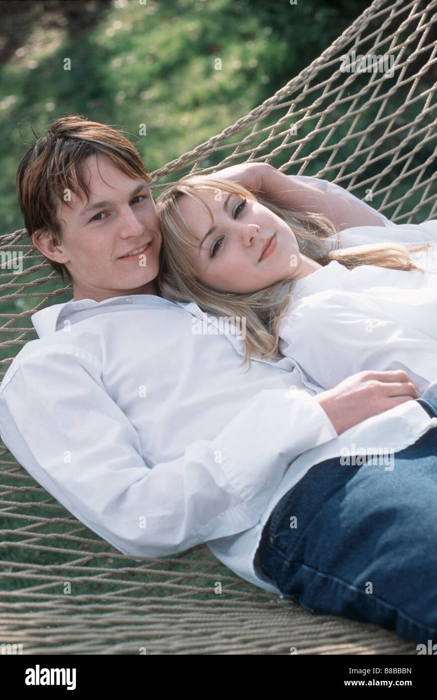 FV4312, Trevor Bonderud; Young Couple Laying Hammock Stock Photo - Alamy