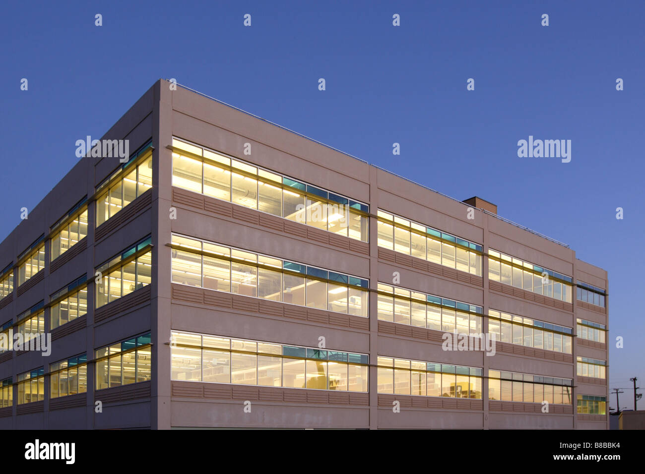 An office building with a empty parking lot Stock Photo - Alamy