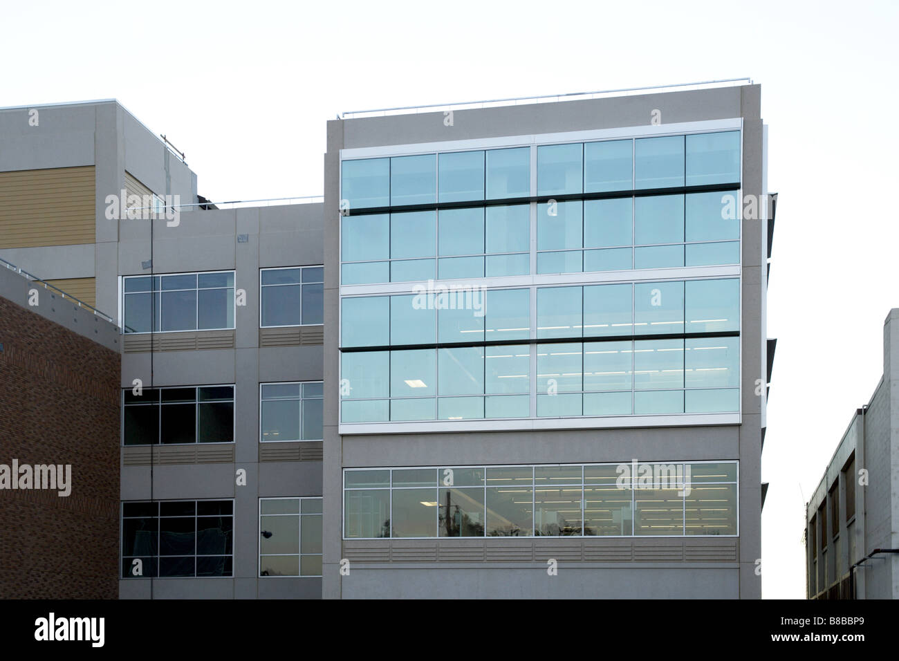 An office building with a empty parking lot Stock Photo - Alamy