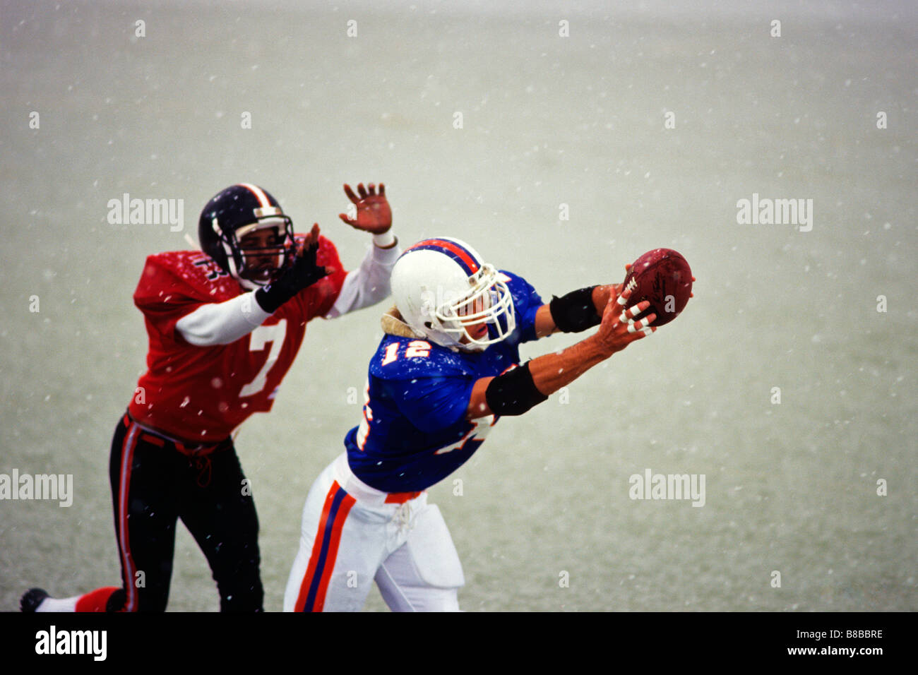 Football players in action Stock Photo - Alamy