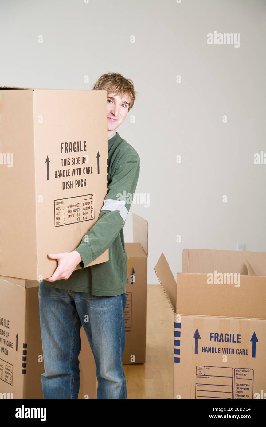 Man Carrying Moving Box Stock Photo - Alamy