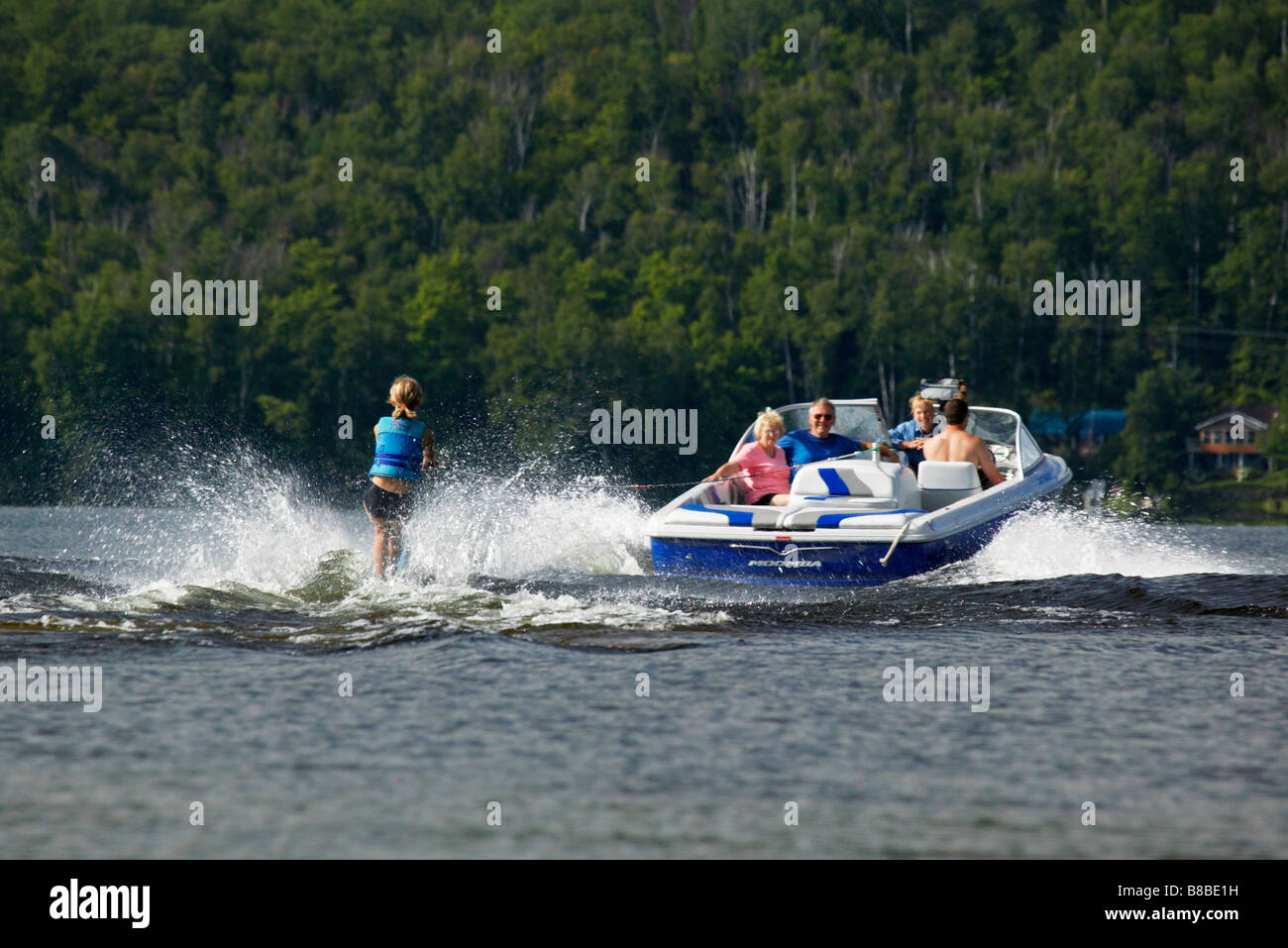 Girl Water Skiing behind Boat Stock Photo - Alamy