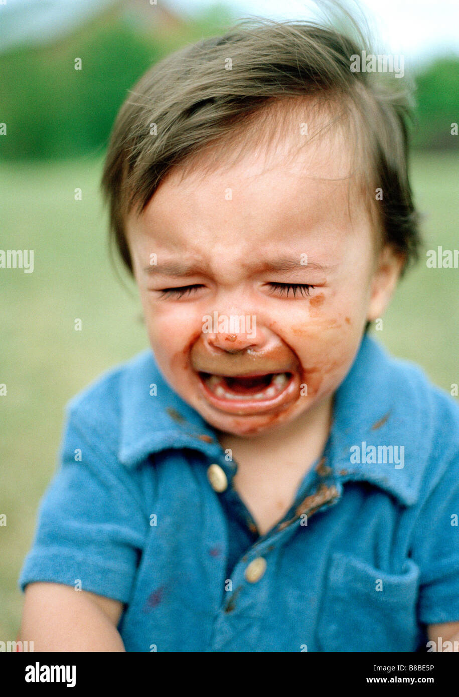Toddler Crying his Face Covered Chocolate Ice Cream Stock Photo - Alamy