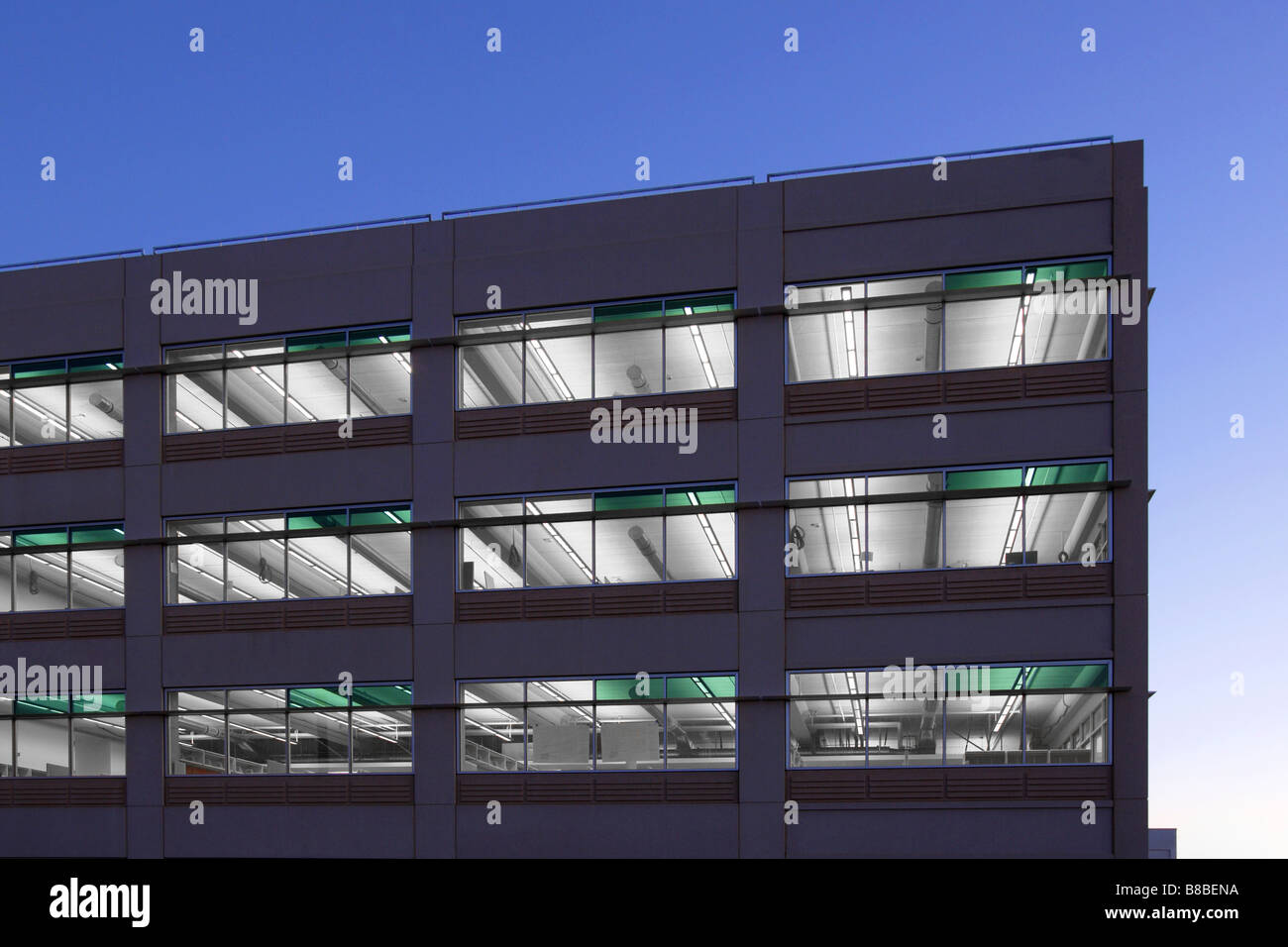 An office building with a empty parking lot Stock Photo - Alamy