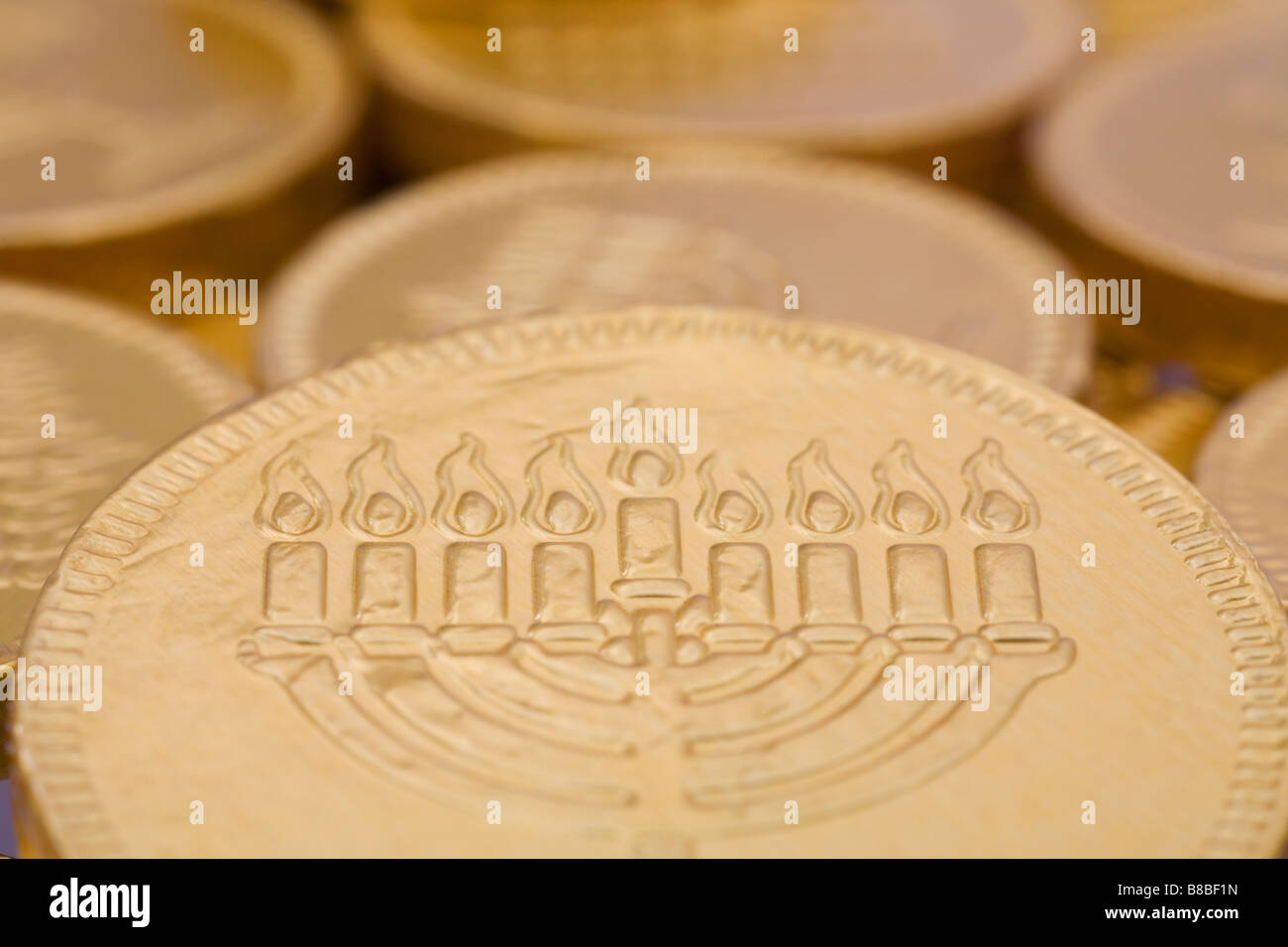 Close up of Hanukkah gelt with menorah imprinted in the foil Stock ...