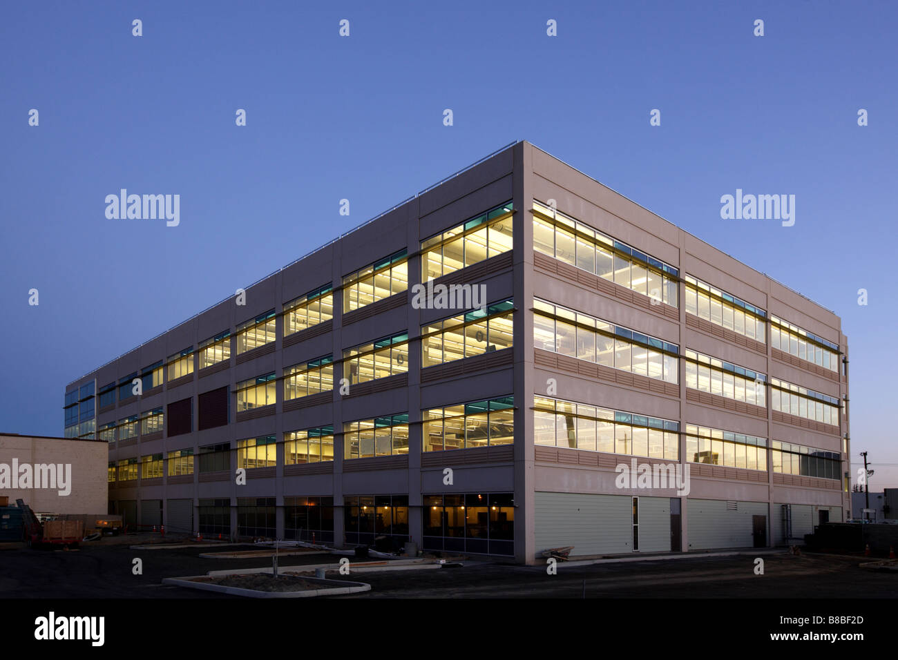 An office building with a empty parking lot Stock Photo - Alamy