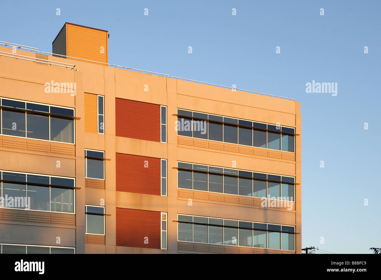 An office building with a empty parking lot Stock Photo - Alamy