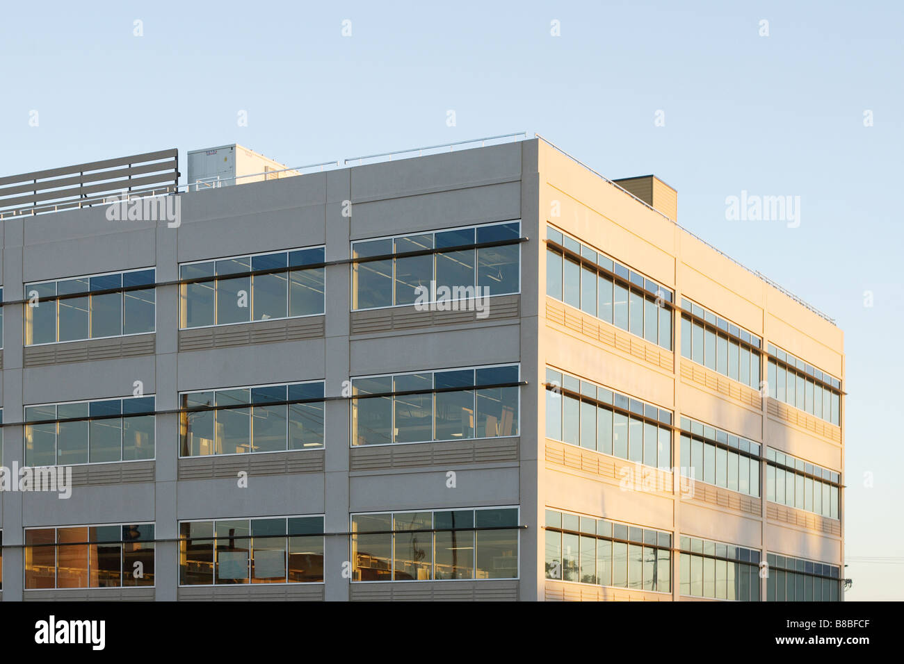 An office building with a empty parking lot Stock Photo - Alamy