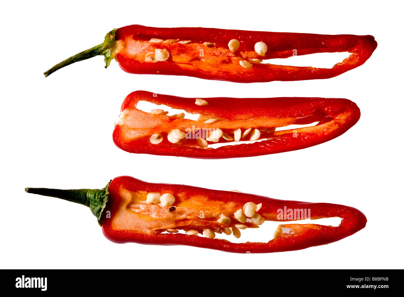 3 chilie peppers sliced open Stock Photo - Alamy