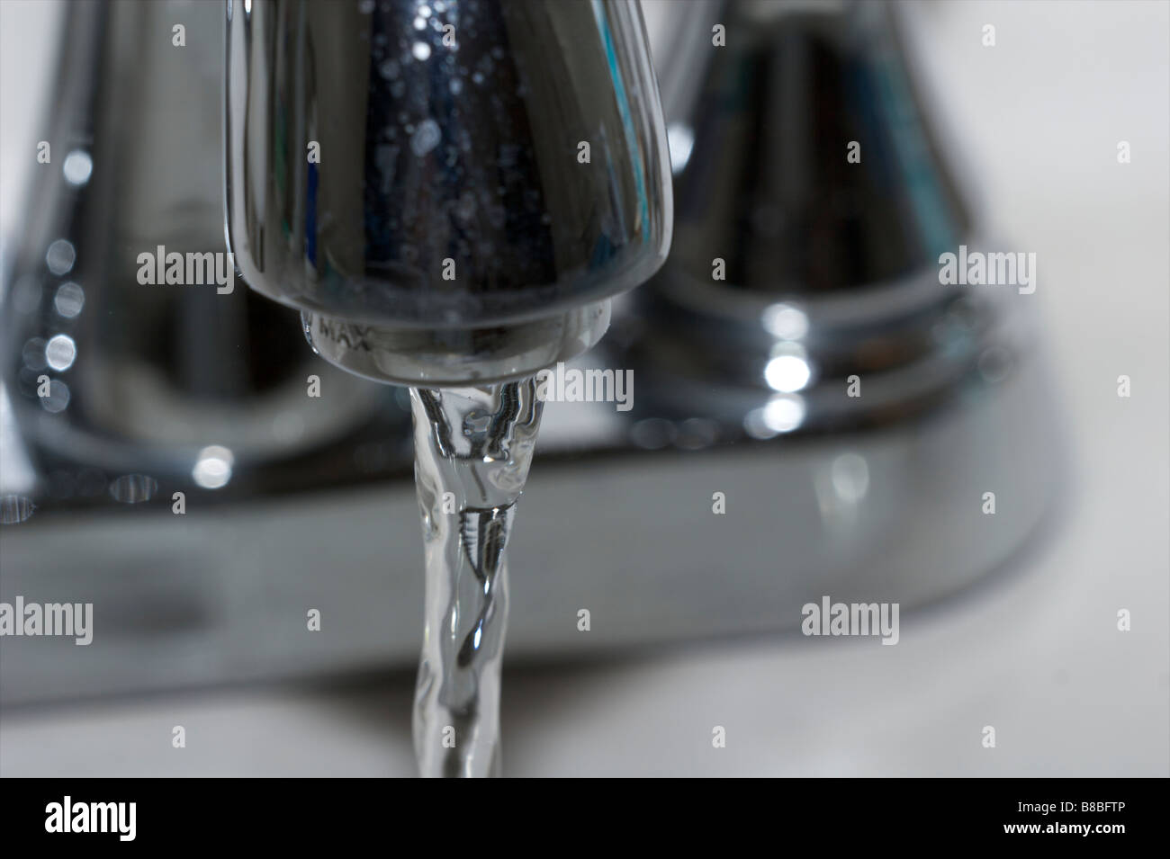 water running out of faucet Stock Photo - Alamy