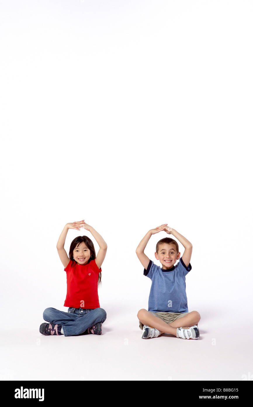 Kids Arms Over Heads Stock Photo - Alamy