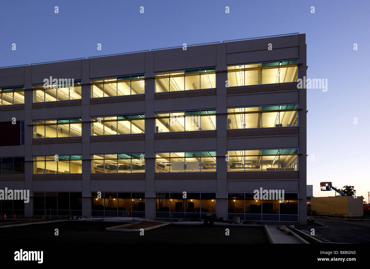 An office building with a empty parking lot Stock Photo - Alamy