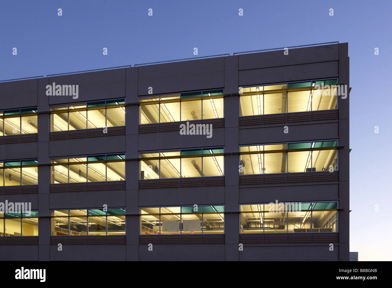 An office building with a empty parking lot Stock Photo - Alamy