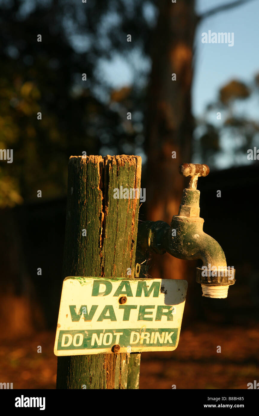 Old Dam Water tap Warning Sign Stock Photo - Alamy