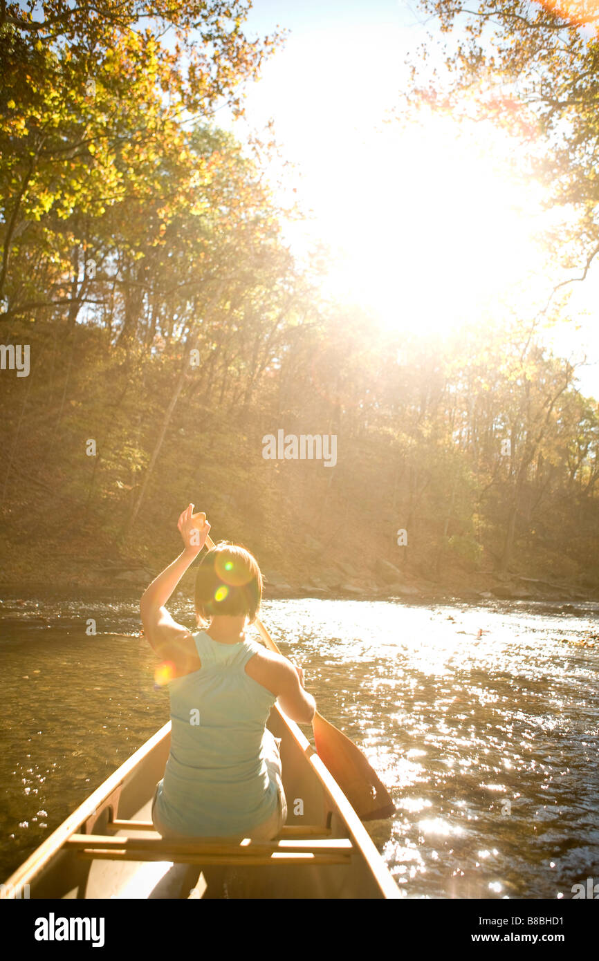 Woman canoeing down the river Stock Photo - Alamy
