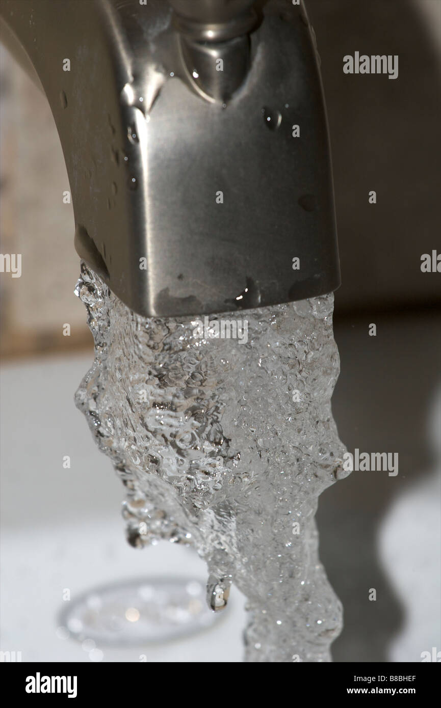 water running out of faucet Stock Photo - Alamy