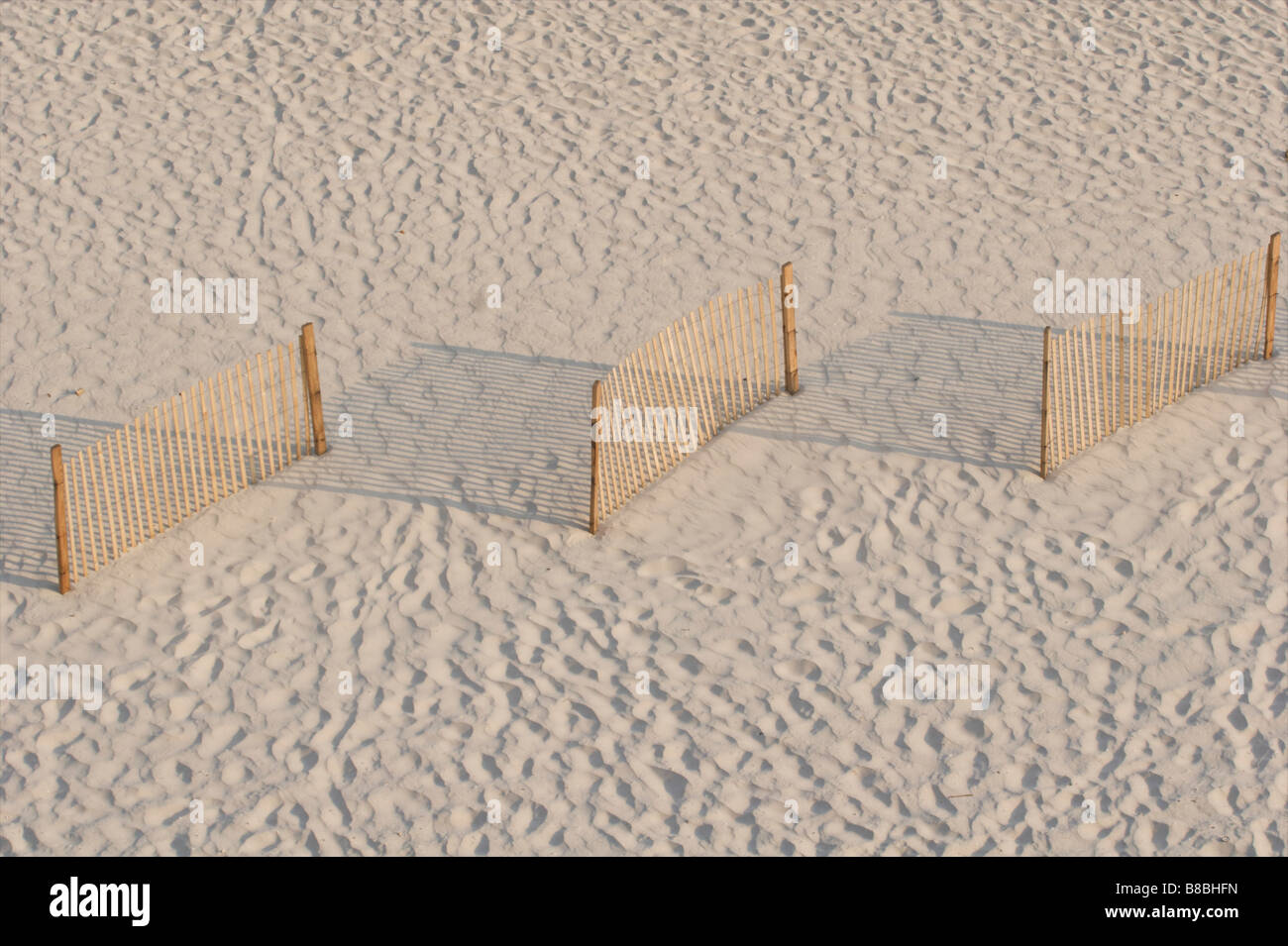row of beach fences Stock Photo - Alamy