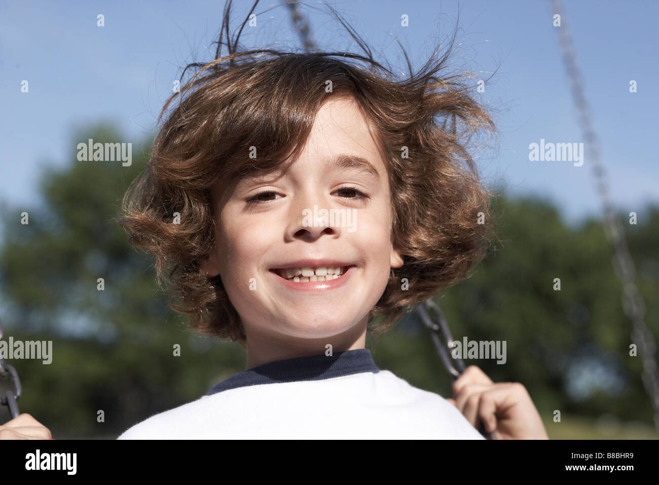 Boy Smiling Swing Stock Photo - Alamy