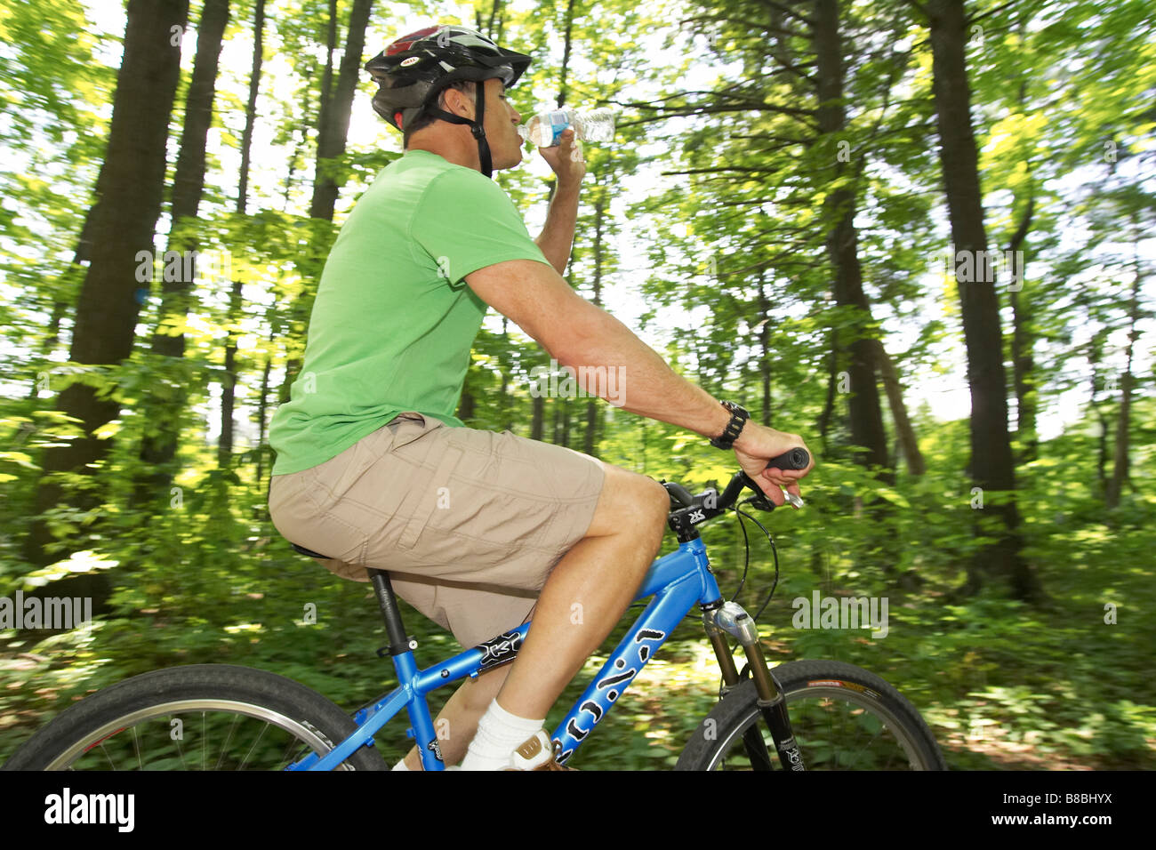 Man Drinking Water while Mountain Biking Trails Stock Photo - Alamy