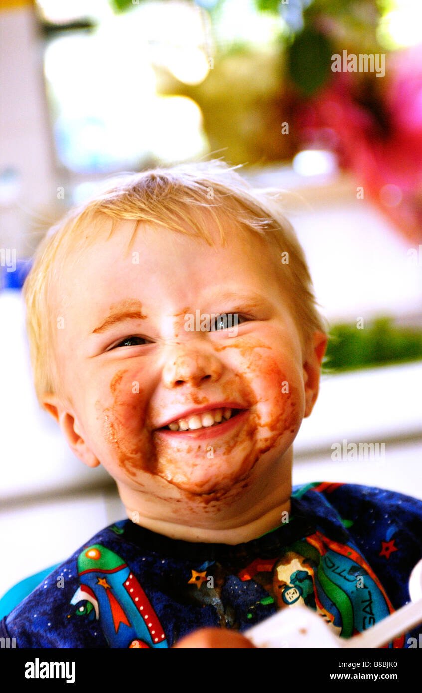 Boy Grinning Chocolate Face Stock Photo - Alamy