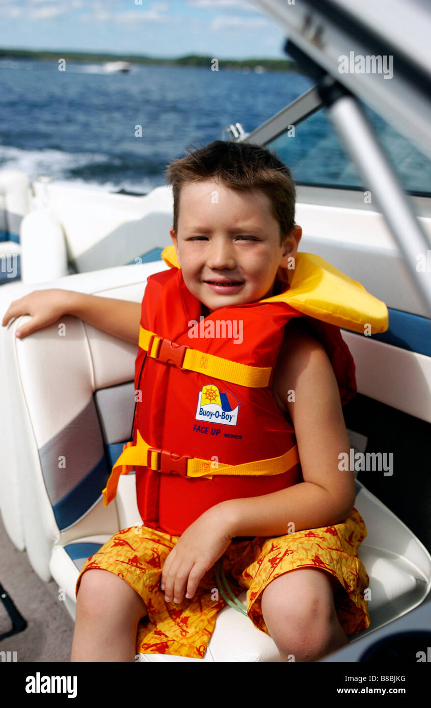 Boy Boat Wearing Life Jacket Stock Photo - Alamy