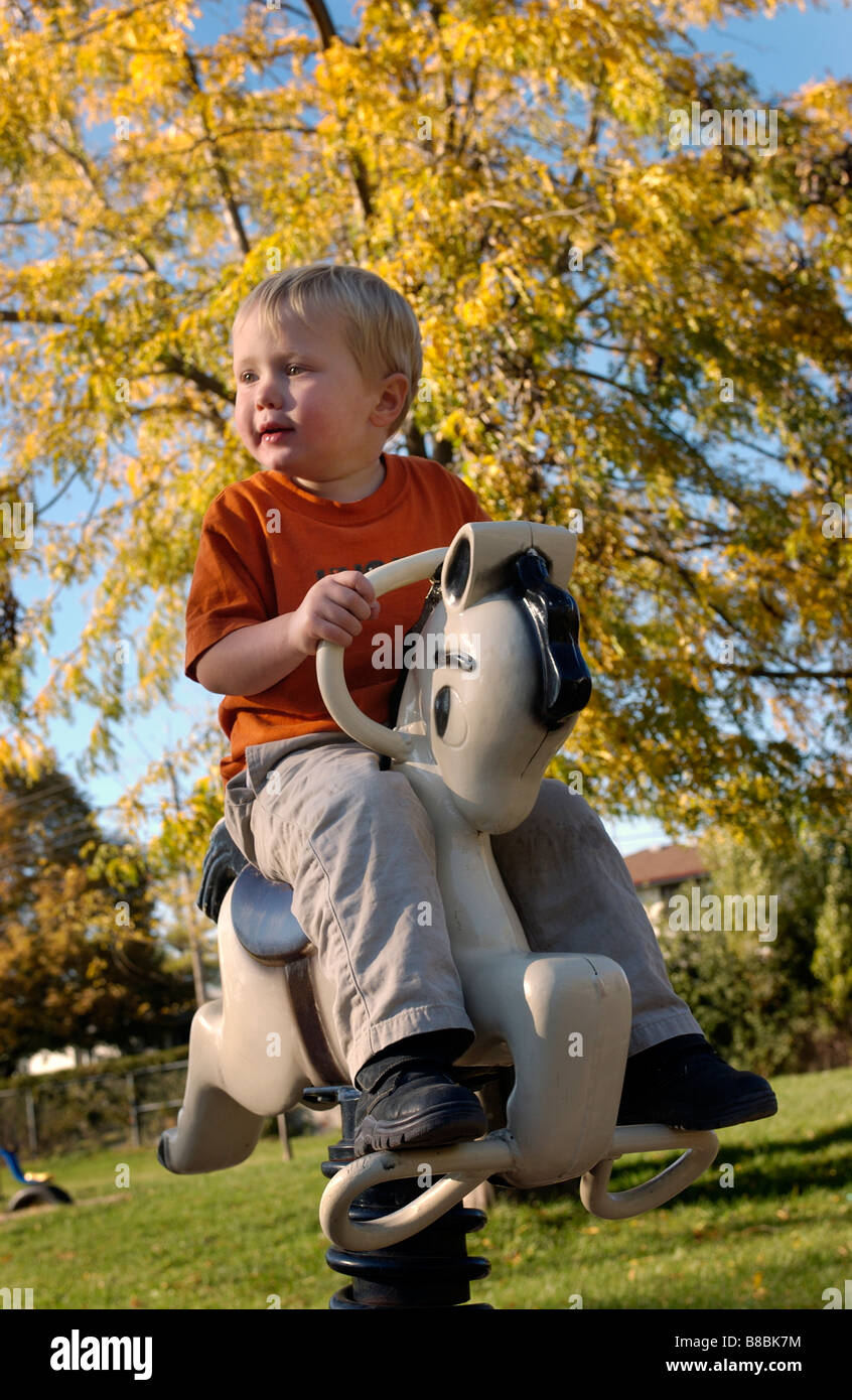 Boy Rocking Horse Playground Stock Photo - Alamy
