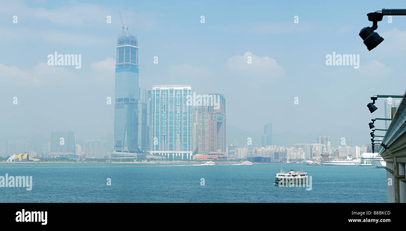Ferry and skyscrapers seen in hazy afternoon light in the Hong Kong ...