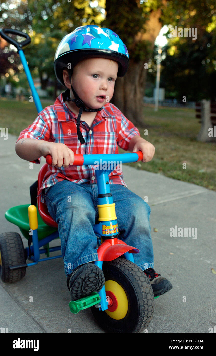 Boy and tricycle hi-res stock photography and images - Alamy