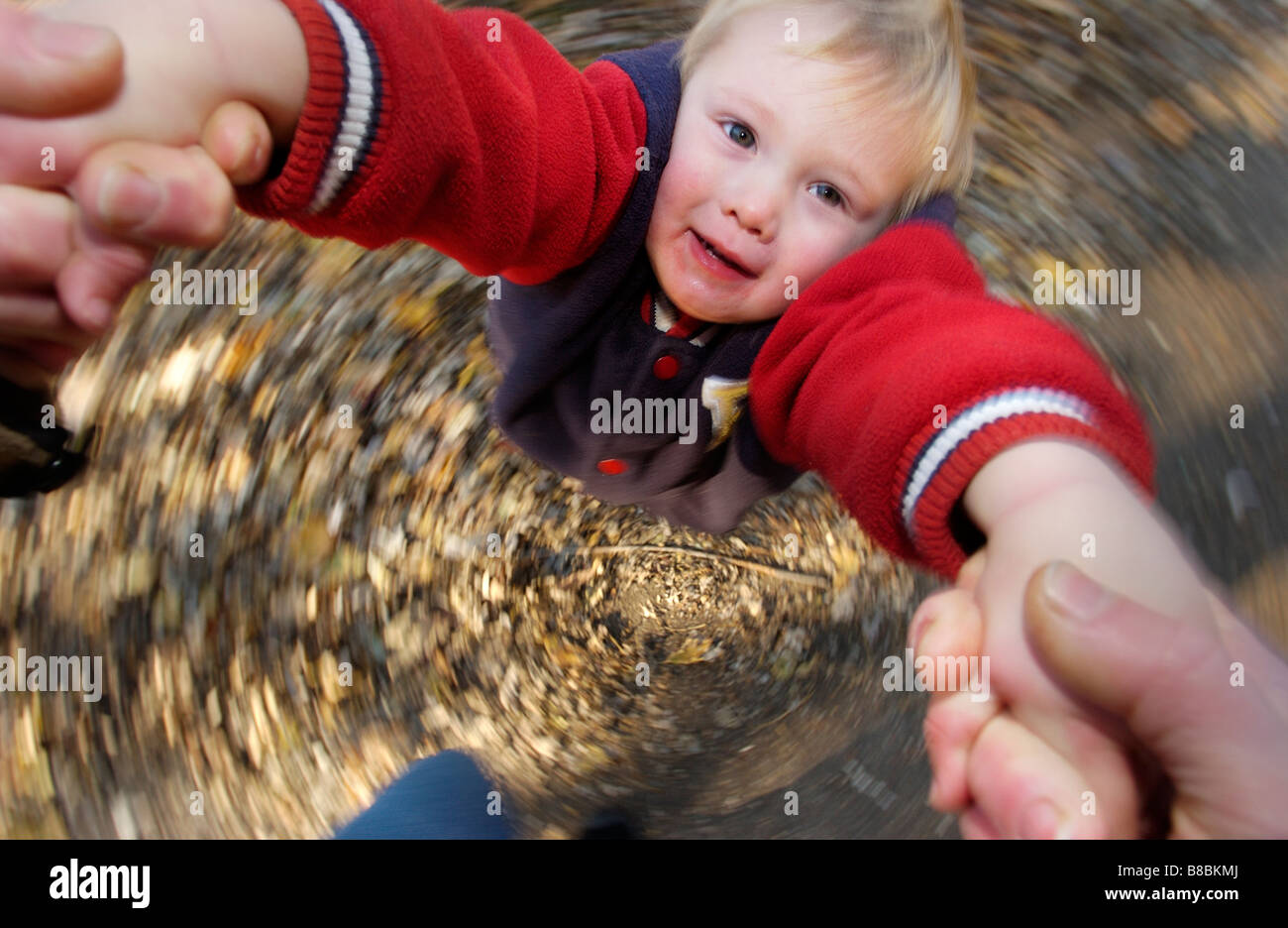 Boy Spinning Around Stock Photo - Alamy