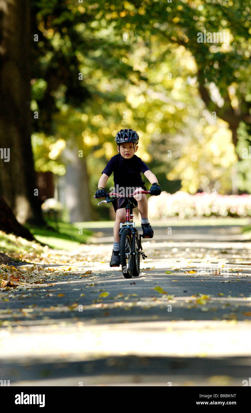 Boy Riding Bicycle Stock Photo - Alamy