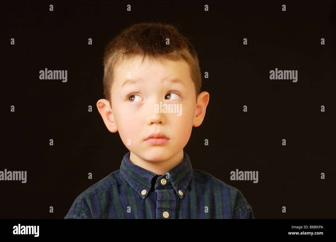 Portrait Boy looking Sideways Stock Photo - Alamy