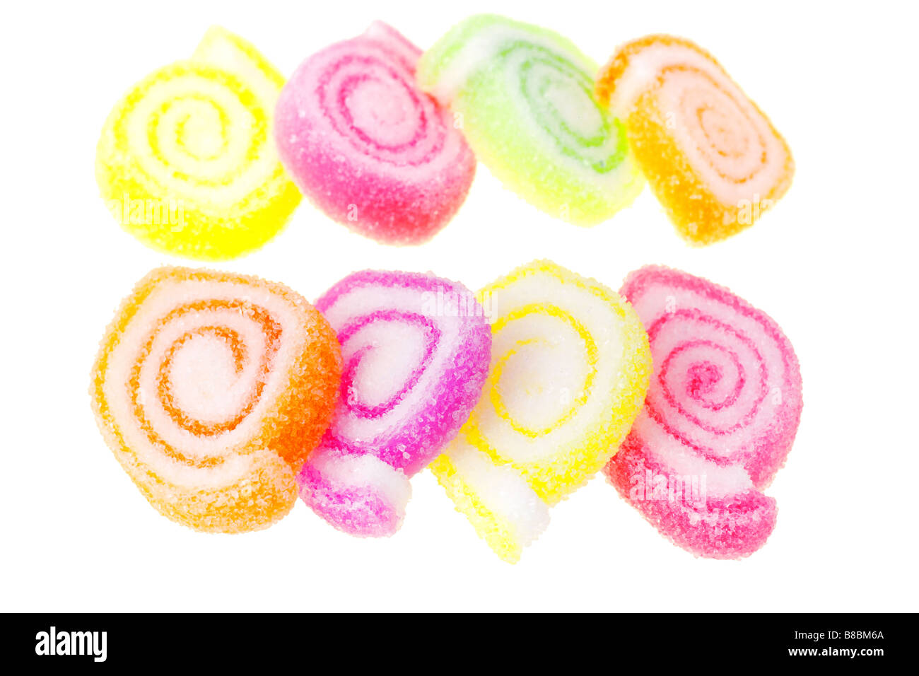 Colorful candy striped on white background Stock Photo - Alamy