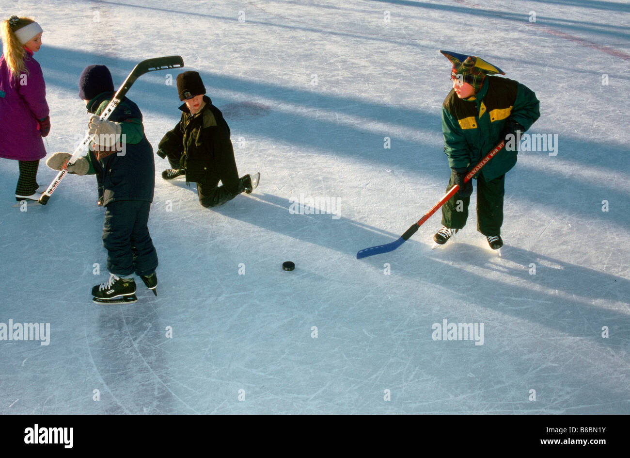 Kids Playing Hockey Outdoors Stock Photo - Alamy