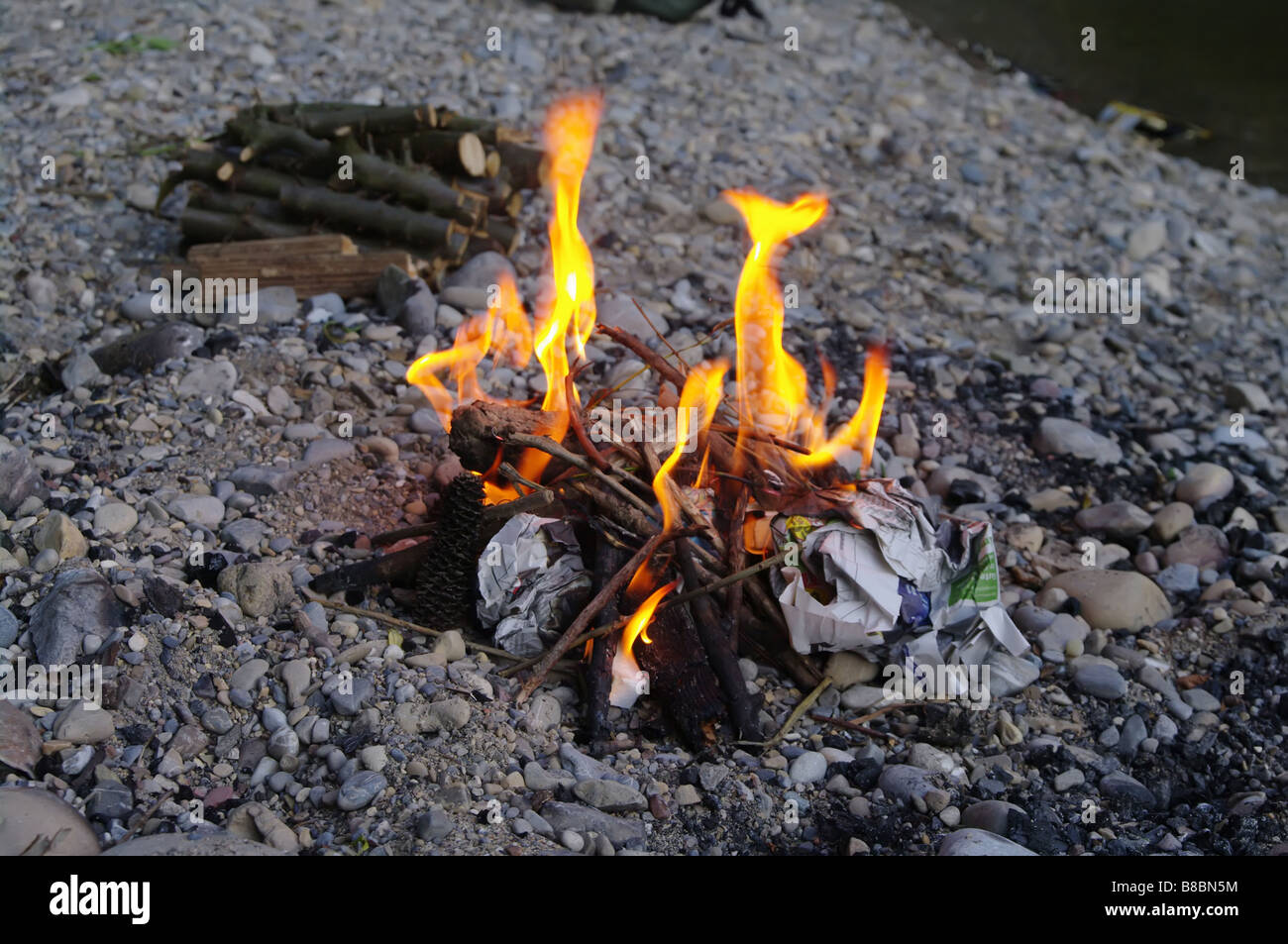 a nice campfire burning outside Stock Photo - Alamy
