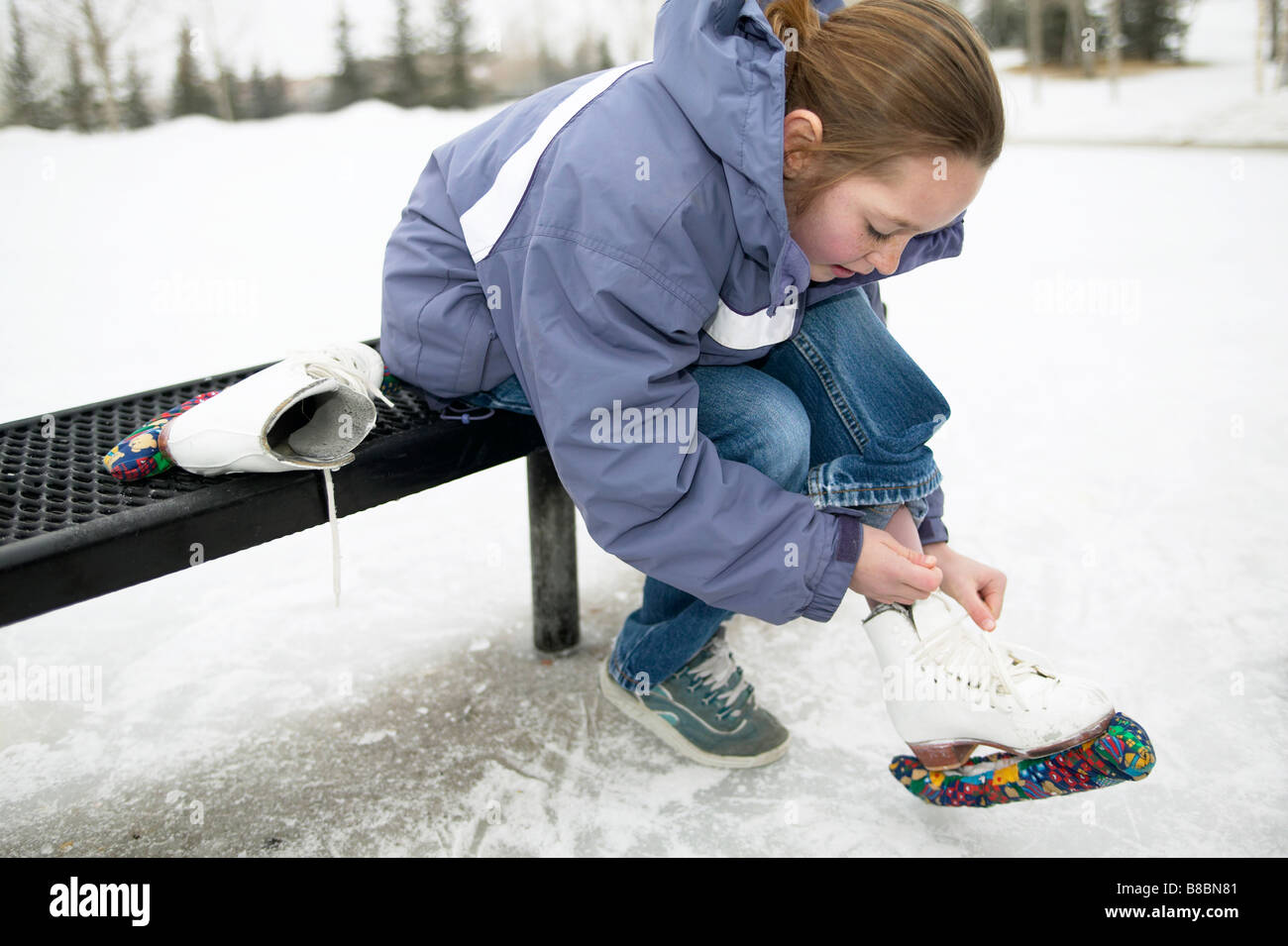 Girl Sitting Bench Putting Skate Outdoor Ice Rink Stock Photo - Alamy