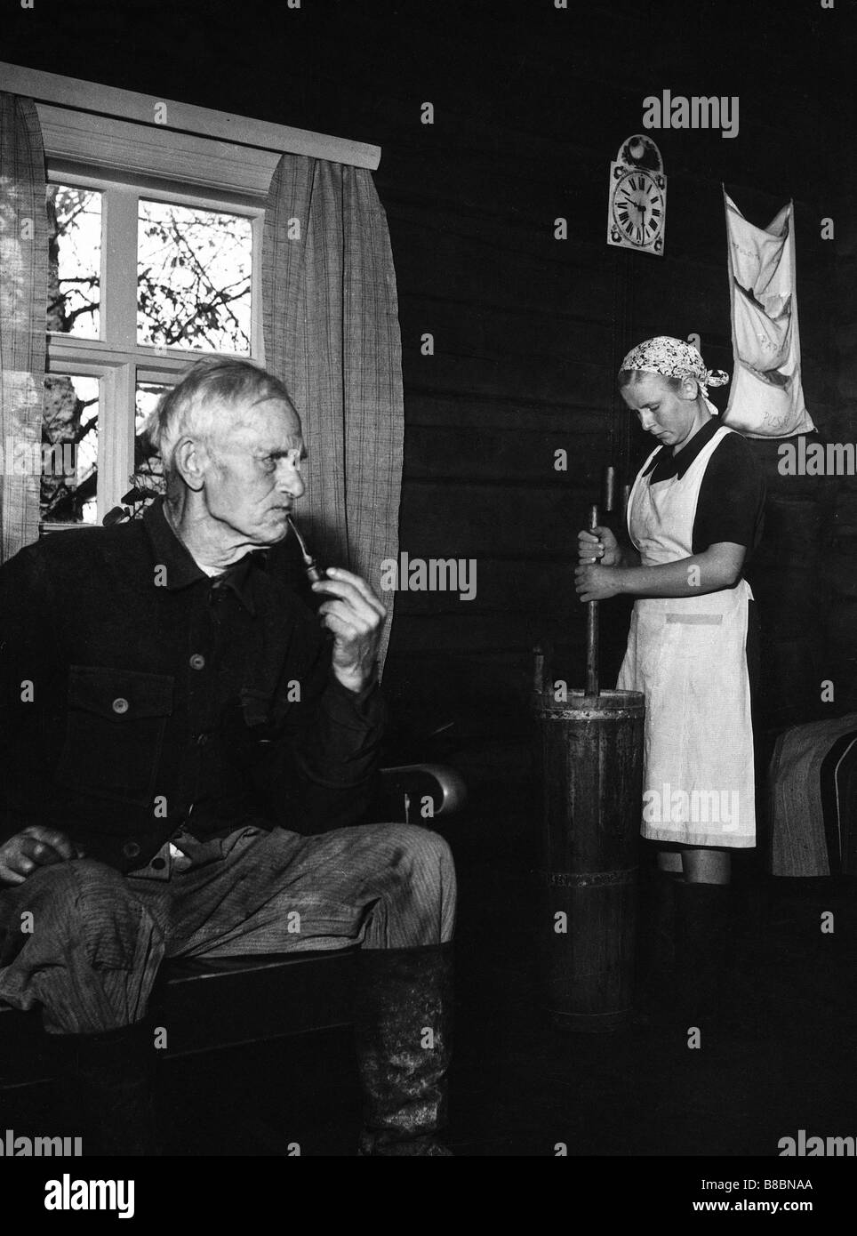 Woman churning butter hi-res stock photography and images - Alamy